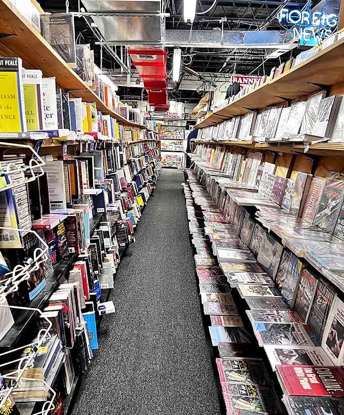 Looking down this narrow passage is like gazing into a paper universe, where each shelf represents a different galaxy of human thought.