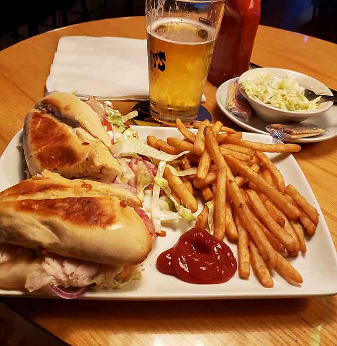A submarine sandwich and fries with a cold beer, because sometimes simple combinations are the best.