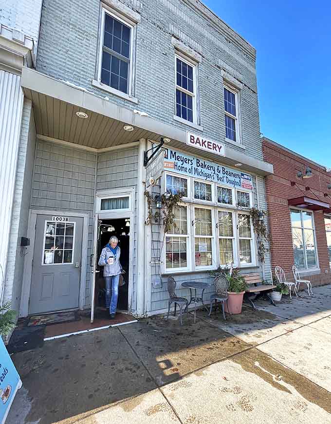 Outside: Small-town charm at its finest – the pale blue exterior and welcoming entrance promise sweet treasures within this Lake Odessa gem.