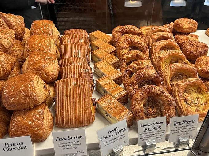 This display case of golden pastries and croissants represents every carb-lover's dream and every diet's worst nightmare, all in one beautiful arrangement.