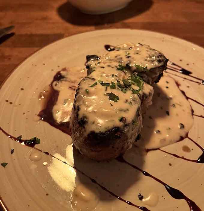 These filet mignon medallions swimming in sauce look like they're enjoying a luxurious spa day before their final destination on your happy palate.