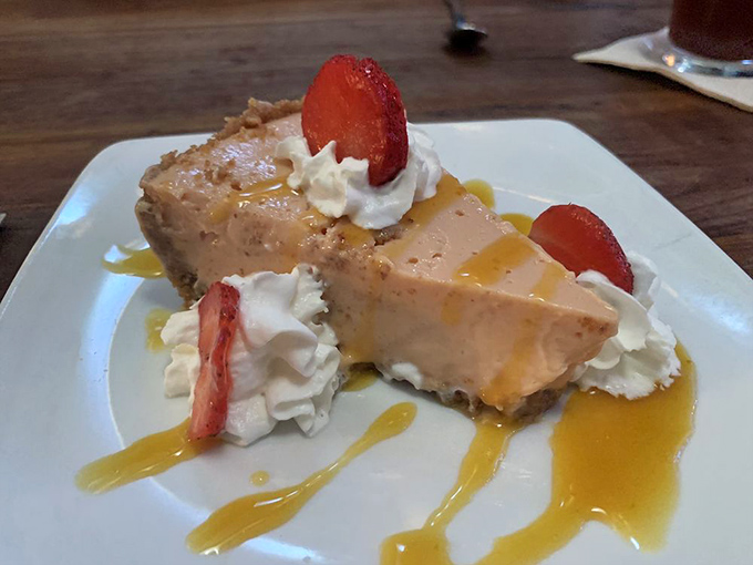 Key lime pie that strikes the perfect balance between tart and sweet, crowned with fresh strawberries and a cloud of whipped cream.