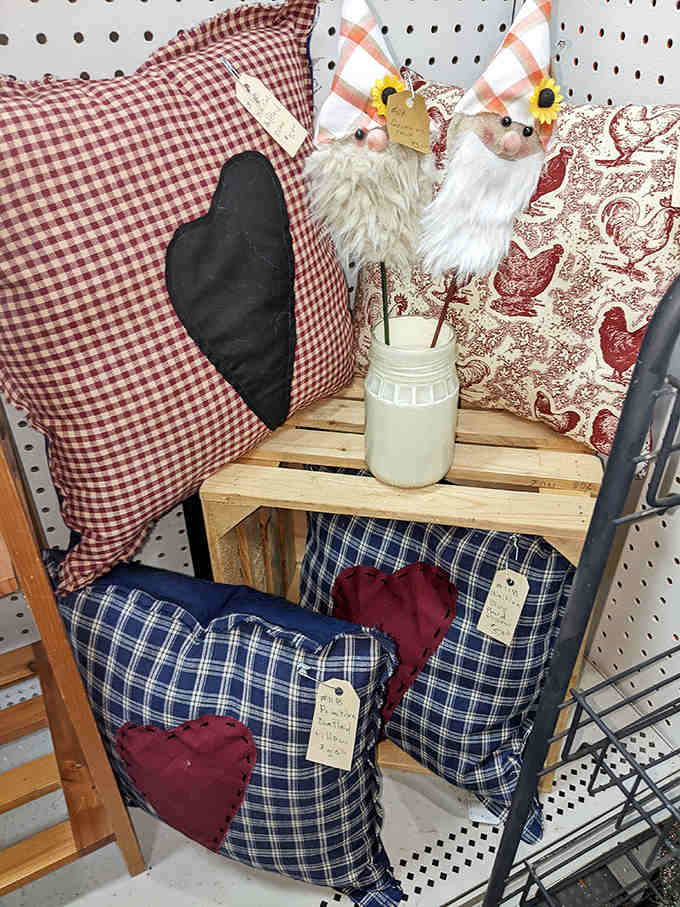 Handcrafted pillows with heart-shaped patches transform simple fabric into cozy comfort, their country charm perfect for anyone looking to add homespun warmth to modern spaces.