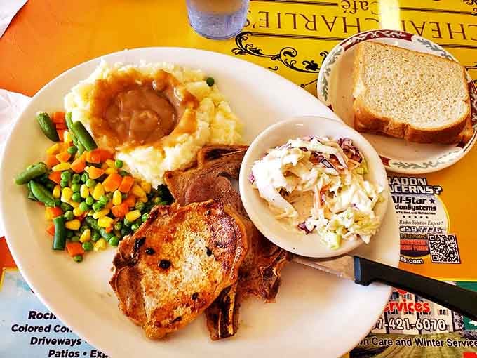 Pork Chop: A plate that screams "you won't be hungry again until dinner" &ndash; hearty, homestyle cooking at its finest.