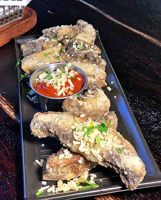 These golden-fried beauties demonstrate that vegetables can absolutely hold their own in the bar food arena when treated right.