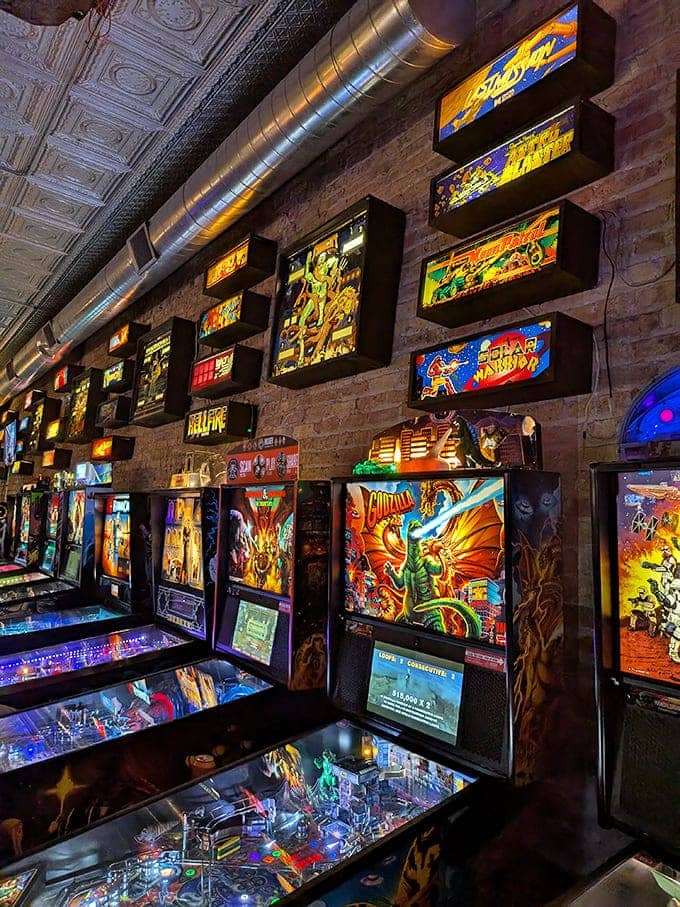 Neon signs and classic cabinets transform this space into a living museum where every exhibit is playable.