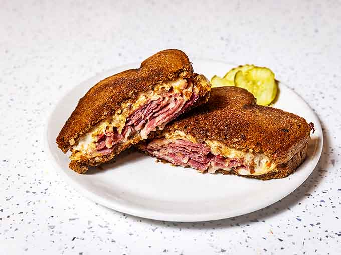 The Reuben sandwich &ndash; where corned beef, sauerkraut and Swiss cheese hold a delicious summit meeting between perfectly grilled rye bread.