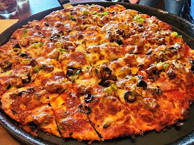 This loaded pizza demonstrates that River Inn Bar & Grill doesn't do anything halfway, including their generous toppings.