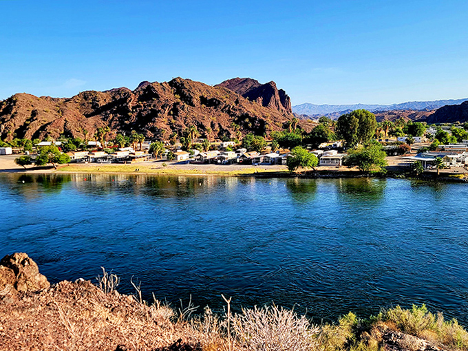 Waterfront property, desert style: homes nestled between mountains and river create a community where nature sets the neighborhood rules.