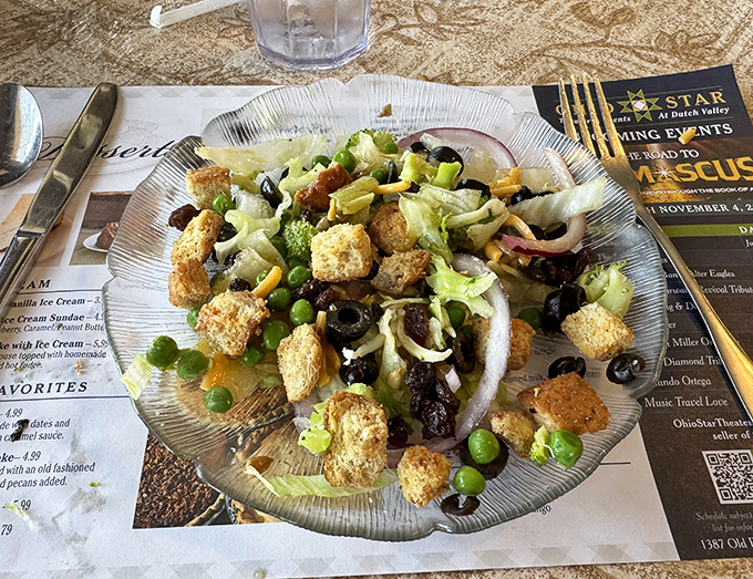 Garden-fresh salad with homemade croutons – because sometimes you need something green before diving into that pie selection.