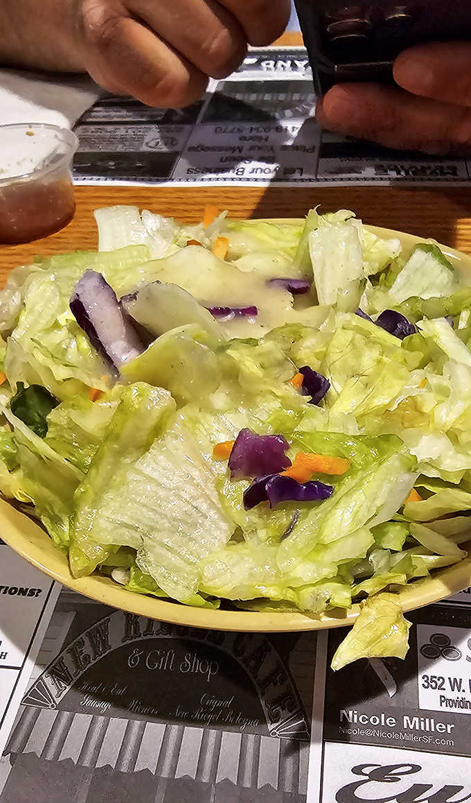 A fresh garden salad provides the perfect counterpoint to the rich BBQ offerings &ndash; crisp, colorful, and surprisingly satisfying.