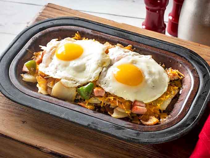 The Shed Skillet sizzles with farm-fresh eggs and colorful vegetables &ndash; breakfast that fuels you like you're about to plow the back forty.