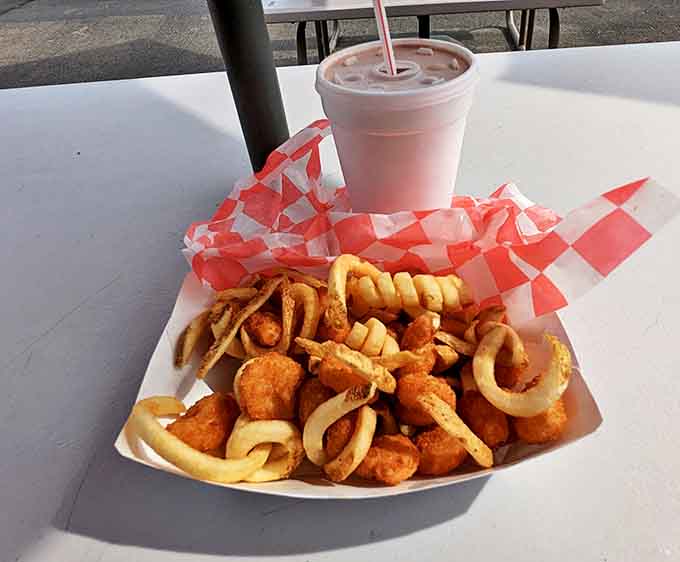Golden-fried treasures from the sea nestled beside curly fries &ndash; a portable feast that brings the boardwalk to your car window.