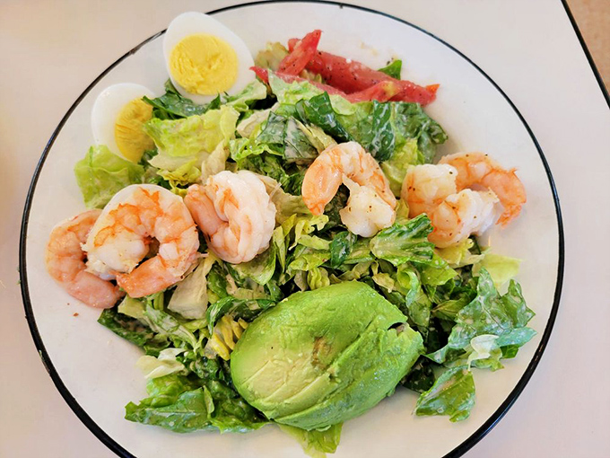 This isn't just any salad – plump shrimp and creamy avocado transform ordinary greens into a protein-packed coastal celebration.