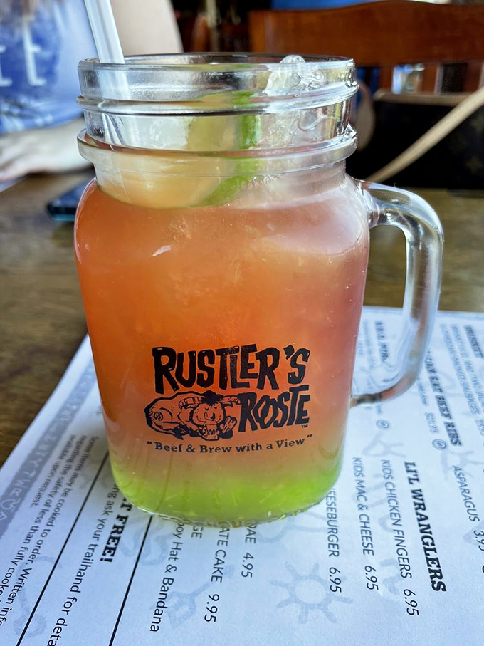 Another colorful concoction from Rustler's bar, this multi-layered drink transitions from lime green to sunset orange like an Arizona sky.