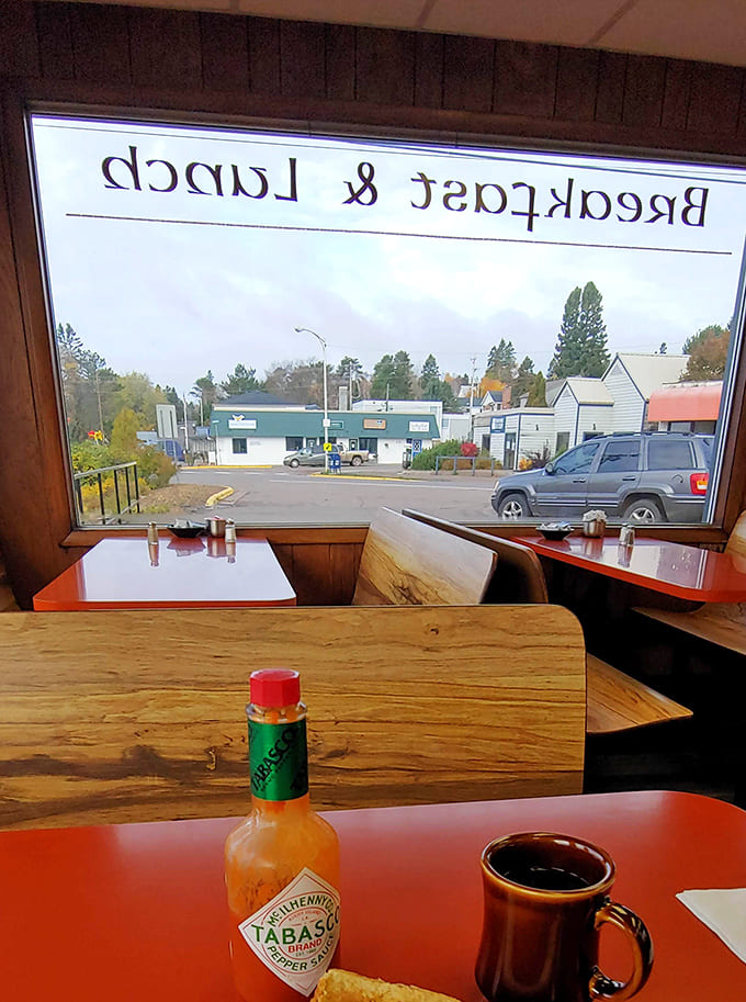 Those vinyl booths have seen countless happy breakfasts, and the "Breakfast & Lunch" window sign tells you everything you need to know.