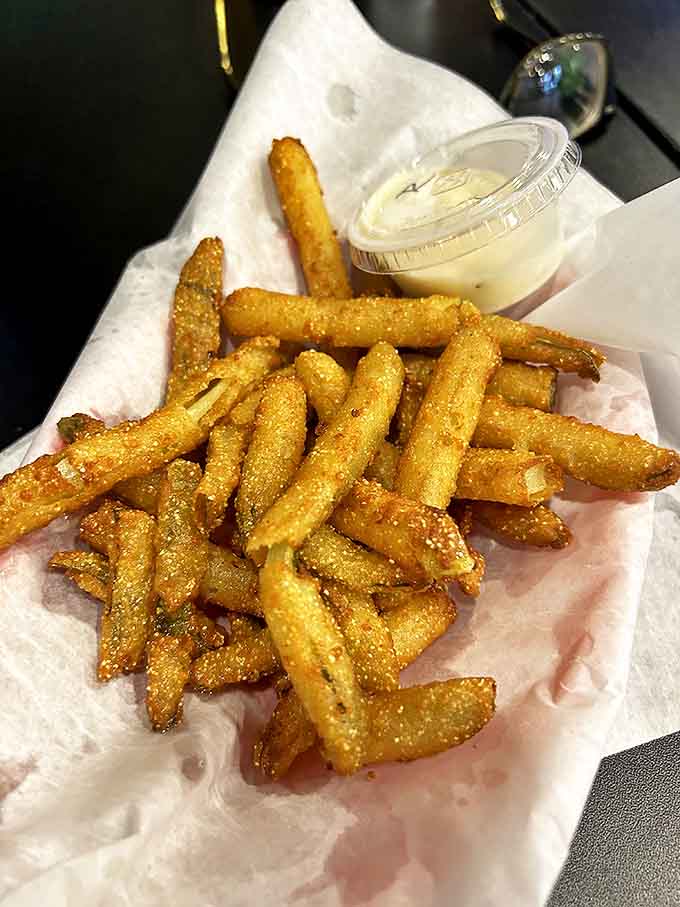 Crispy, tangy, spicy &ndash; these cornmeal-battered pickle spears might just upstage the meat if they weren't such perfect companions.