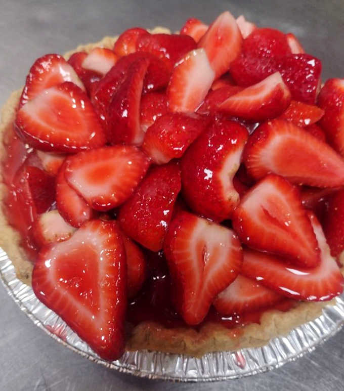 Homemade strawberry pie piled high with fresh berries makes saving room for dessert a decision you'll never regret making.