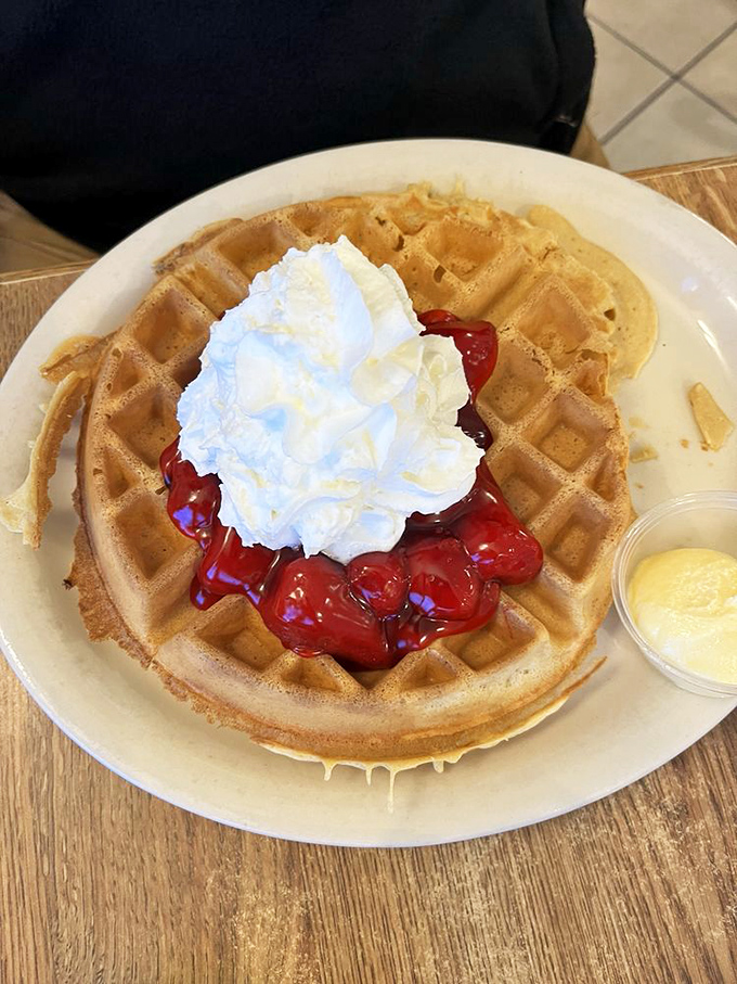 Cherry-topped waffle perfection that makes breakfast feel like dessert – without an ounce of morning guilt.