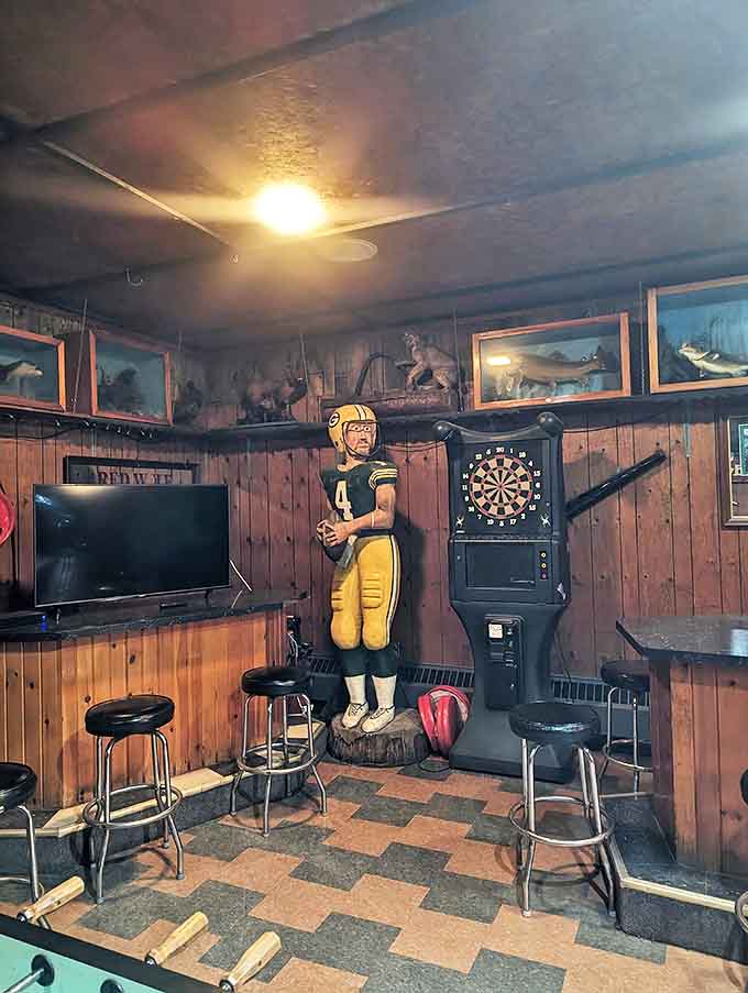A life-sized Packers player stands sentinel in the corner, a nod to the UP's unique position between Michigan and Wisconsin sports loyalties.