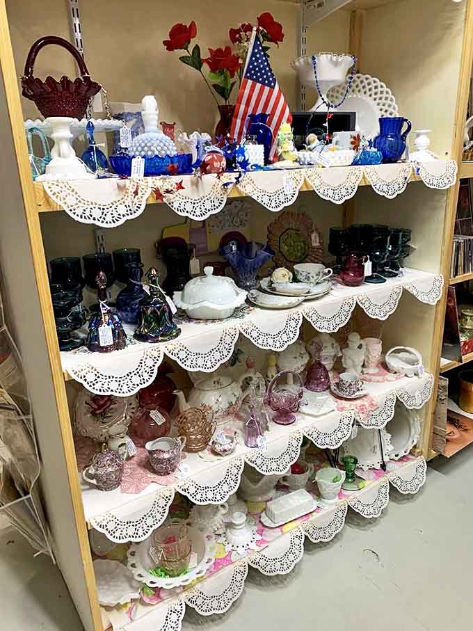 Patriotic porcelain mingles with ruby glass and delicate lace doilies, creating a display that would make any grandmother nod with approval.