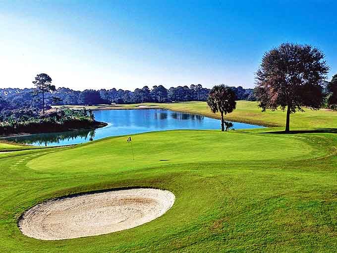 The Amelia River Club's golf course stretches out in emerald perfection, where water hazards are actually beautiful enough to make you forget you just lost another ball.