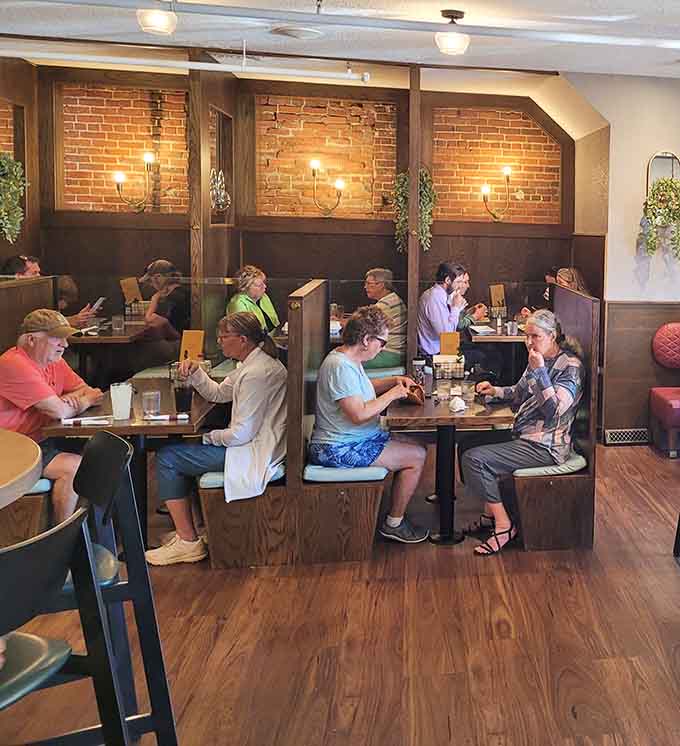 The dining room buzzes with happy conversations as locals and visitors alike settle into comfortable booths for another satisfying meal.