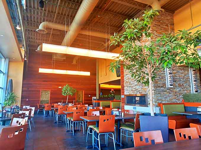 High ceilings, stone accents, and natural wood create a space that feels simultaneously spacious and cozy &ndash; perfect for savoring every bite.