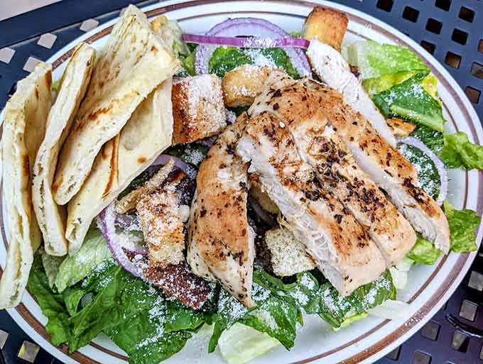 Even the salads here refuse to be boring, featuring grilled chicken that makes eating your greens feel less like punishment.