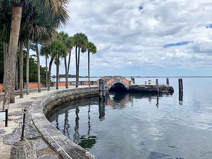 Palm trees stand sentinel along Biscayne Bay, where Mediterranean dreams and Florida reality blend into waterfront perfection.