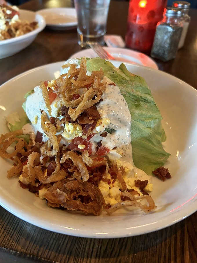 The wedge salad &ndash; where humble iceberg becomes a throne for bacon, blue cheese, and house-made dressing that puts bottled versions to shame.