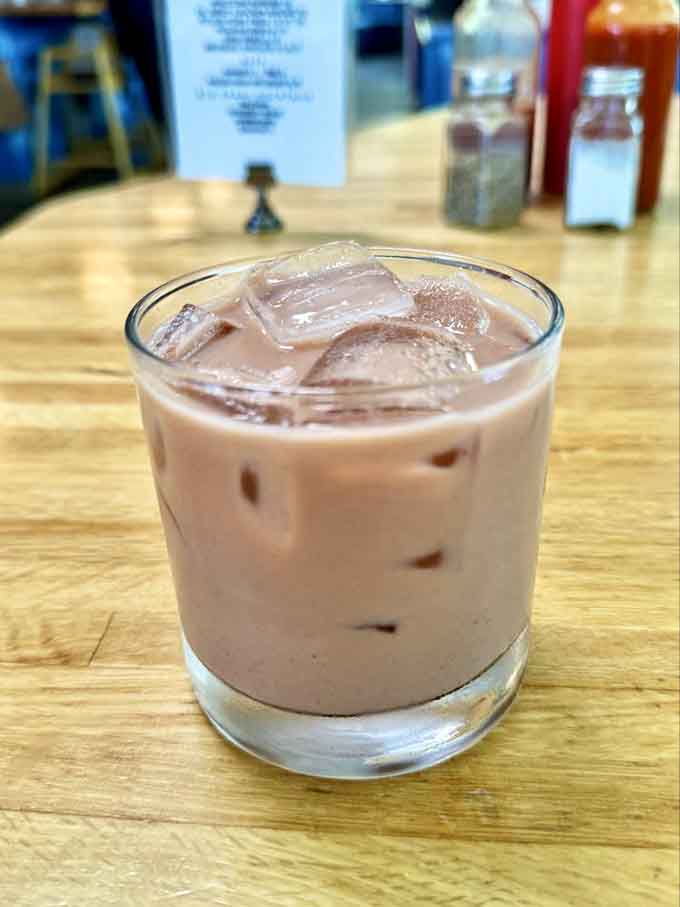 An iced chai latte that's smooth, spiced, and exactly what you need to complement your savory selections here.