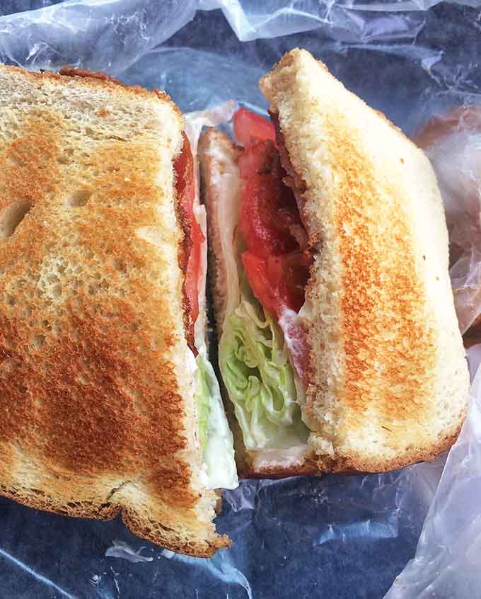 Not just another sandwich, but a carefully constructed flavor delivery system, where each ingredient plays its part in perfect harmony.