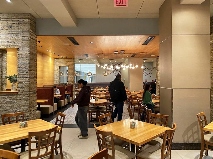 The dining area buzzes with the energy of people who know they're about to eat something special, and they're absolutely right.