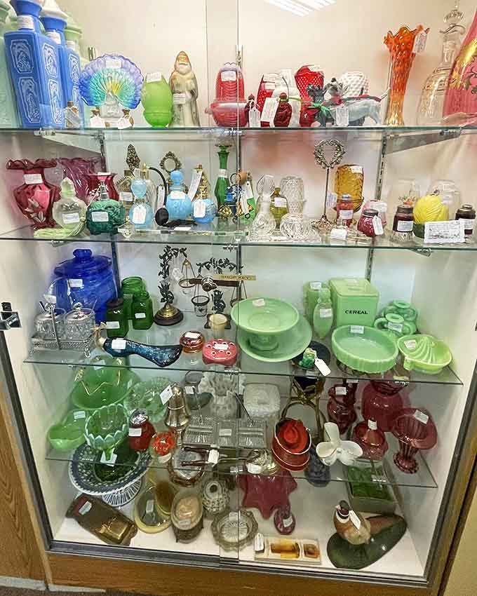 A rainbow of Depression glass and vintage dishware creates a colorful timeline of American domestic life, each piece waiting for a new home.