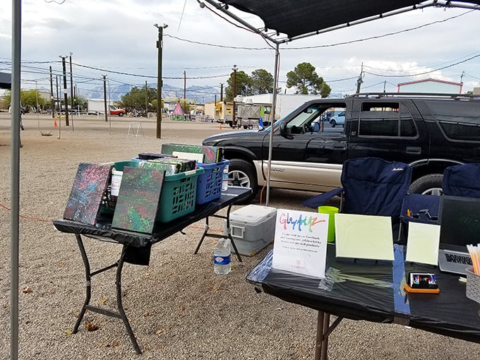Artist at work! Local creators often demonstrate their craft at the swap meet, connecting shoppers directly with the makers of unique items.