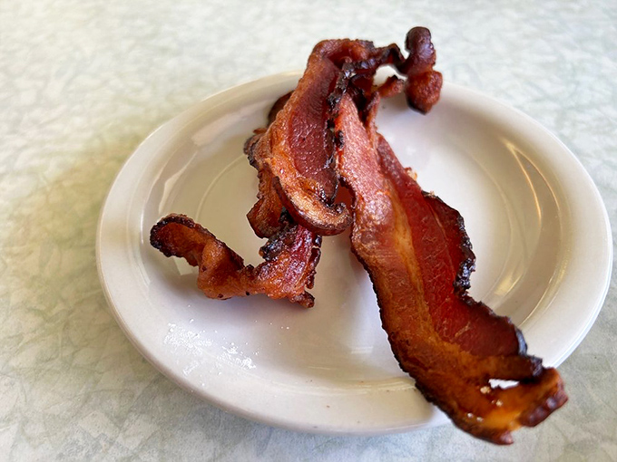Bacon cooked to that magical point between chewy and crisp – the kind that makes vegetarians question their life choices.