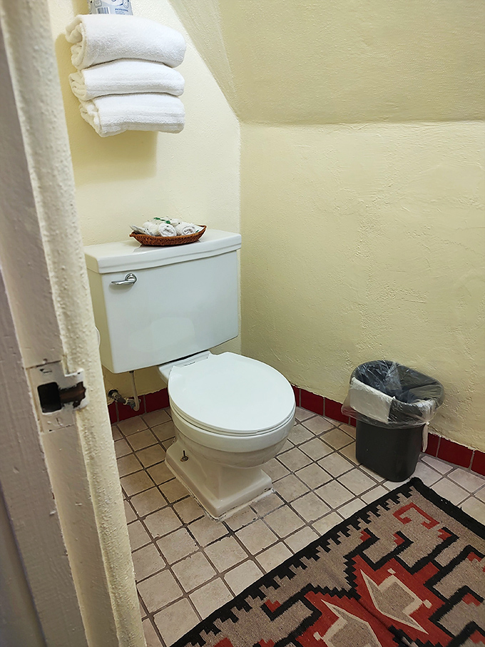 Even the bathrooms maintain the Southwestern theme, with Native-inspired rugs adding a touch of color to practical spaces.