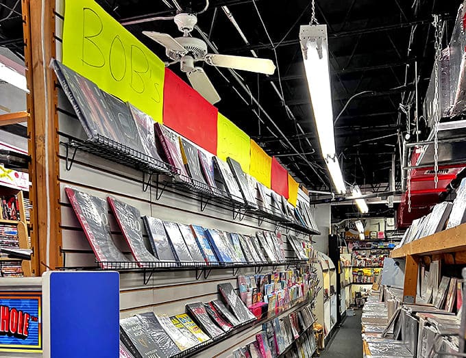 Bestsellers and unique finds share space under colorful signage, creating a vibrant literary marketplace.