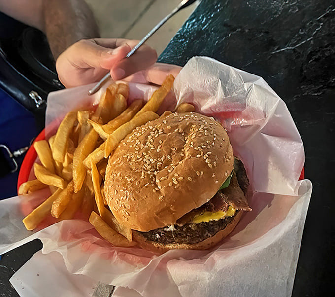 A juicy burger and golden fries arrive in an unpretentious basket &ndash; comfort food that satisfies without unnecessary frills or fuss.
