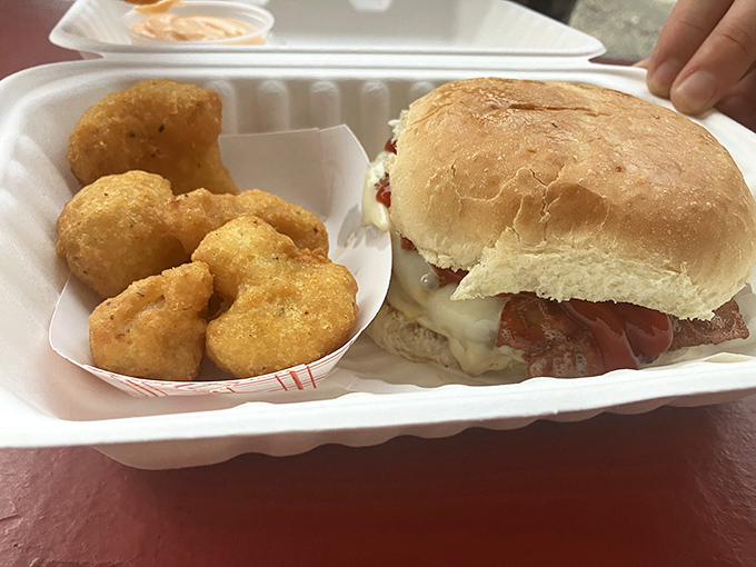The perfect lunch tray: a burger that means business, tater tots with golden crunch, and the promise of a nap afterward.