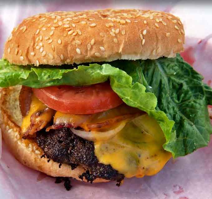 That burger is stacked higher than your expectations and somehow manages to exceed them anyway with every juicy bite.