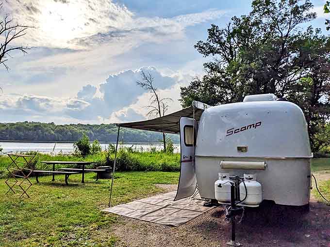 Glamping goals! This cozy Scamp camper has scored the ultimate lakeside real estate for a perfect Minnesota getaway.