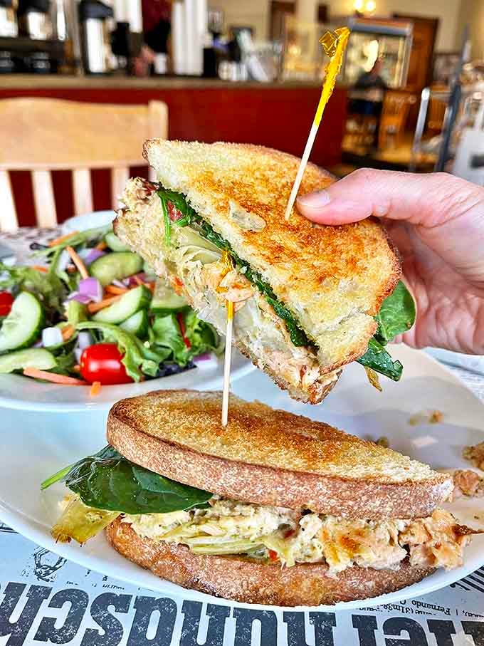 The club sandwich &ndash; not just stacked with turkey, ham and bacon, but assembled with the architectural precision of someone who truly understands sandwich engineering.