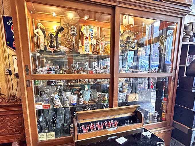 This cabinet of curiosities holds everything from glassware to memorabilia, each piece with its own story to tell.