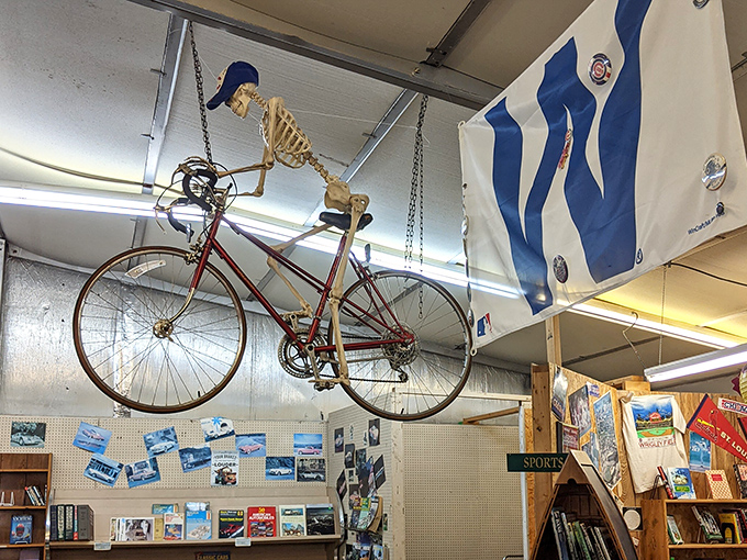 A skeleton cyclist eternally pedals overhead, just one of many whimsical decorative touches throughout the store.