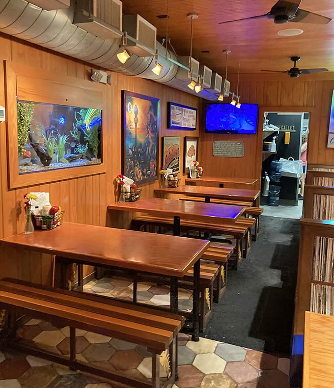 The dining area's warm wood tones and aquarium create the perfect backdrop for seafood feasts &ndash; casual enough for flip-flops, special enough for celebrations.
