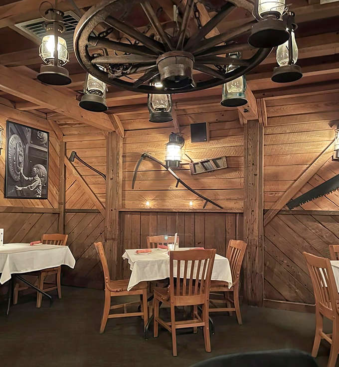 Rustic charm meets refined dining under a wagon wheel chandelier, where lantern lights create the perfect ambiance for making memories over meals that matter.