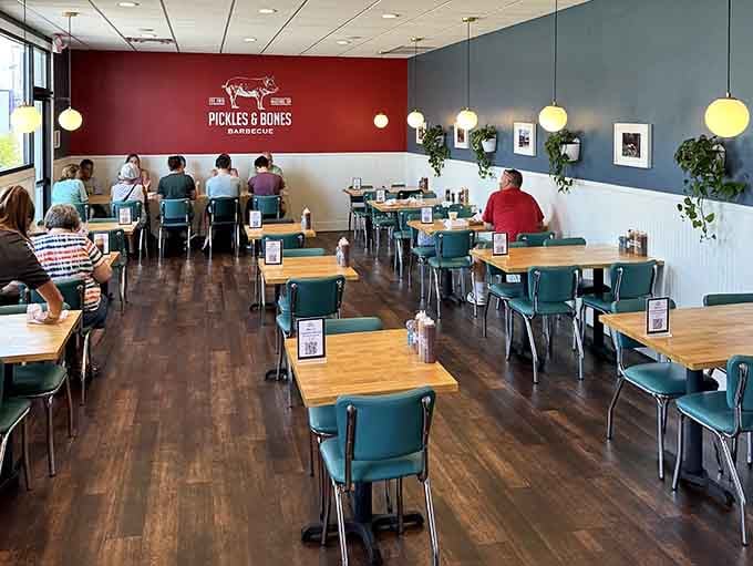 Dining Room Where orange walls and eclectic d&eacute;cor create the perfect backdrop for memorable meals and even better conversations.