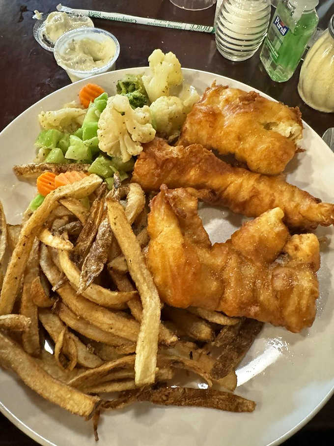 Friday's fish fry features flaky white fish in a light, crispy batter that shatters pleasingly with each bite.